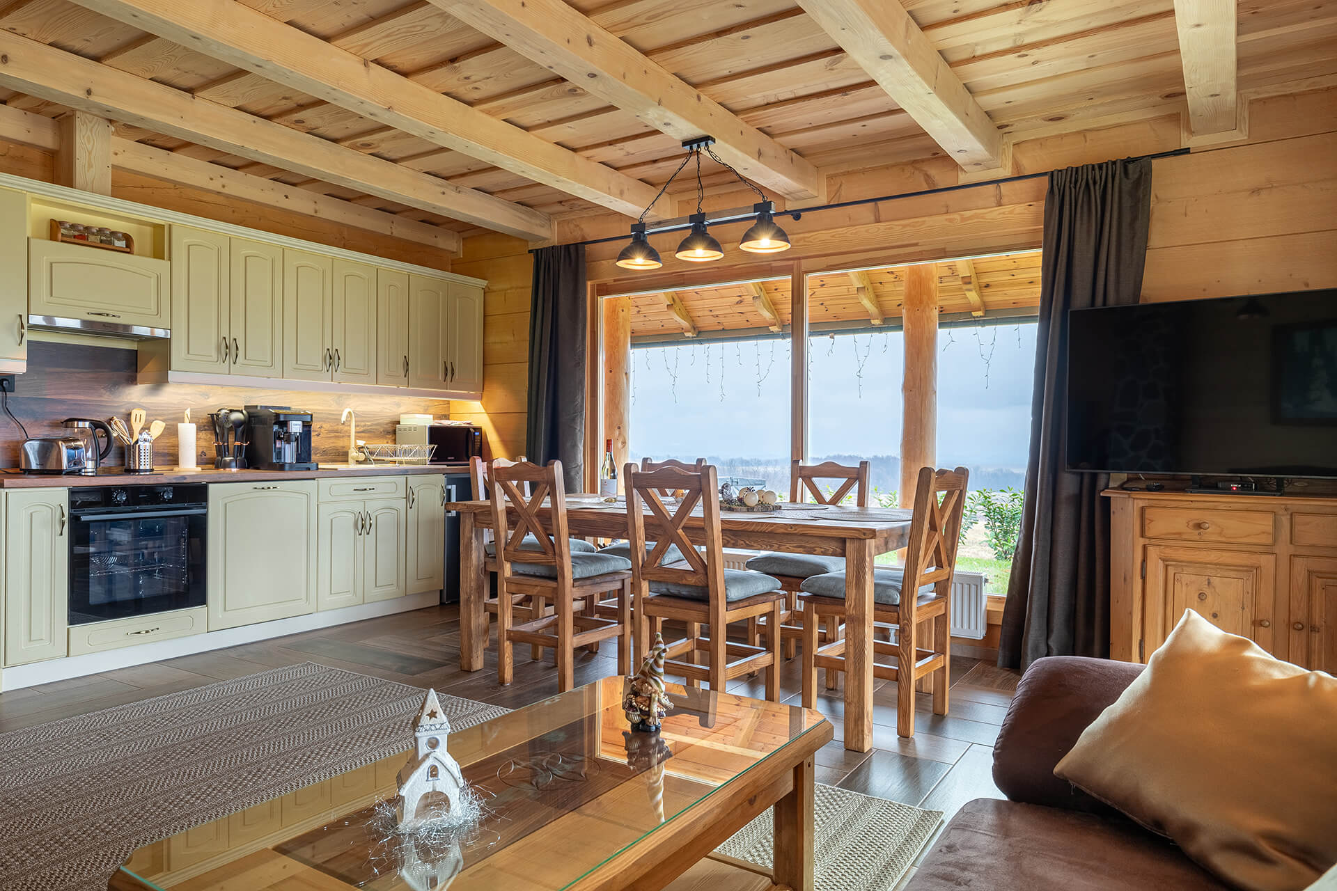 Rólunk - Hanga Prémium Rönkház